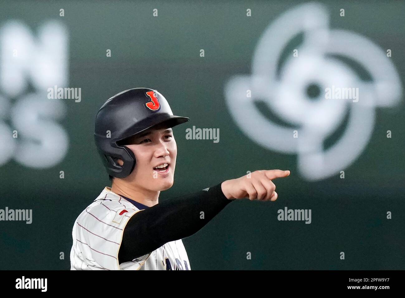 Shohei Ohtani of Japan gestures on second base during the fifth inning of the quarterfinal game ...