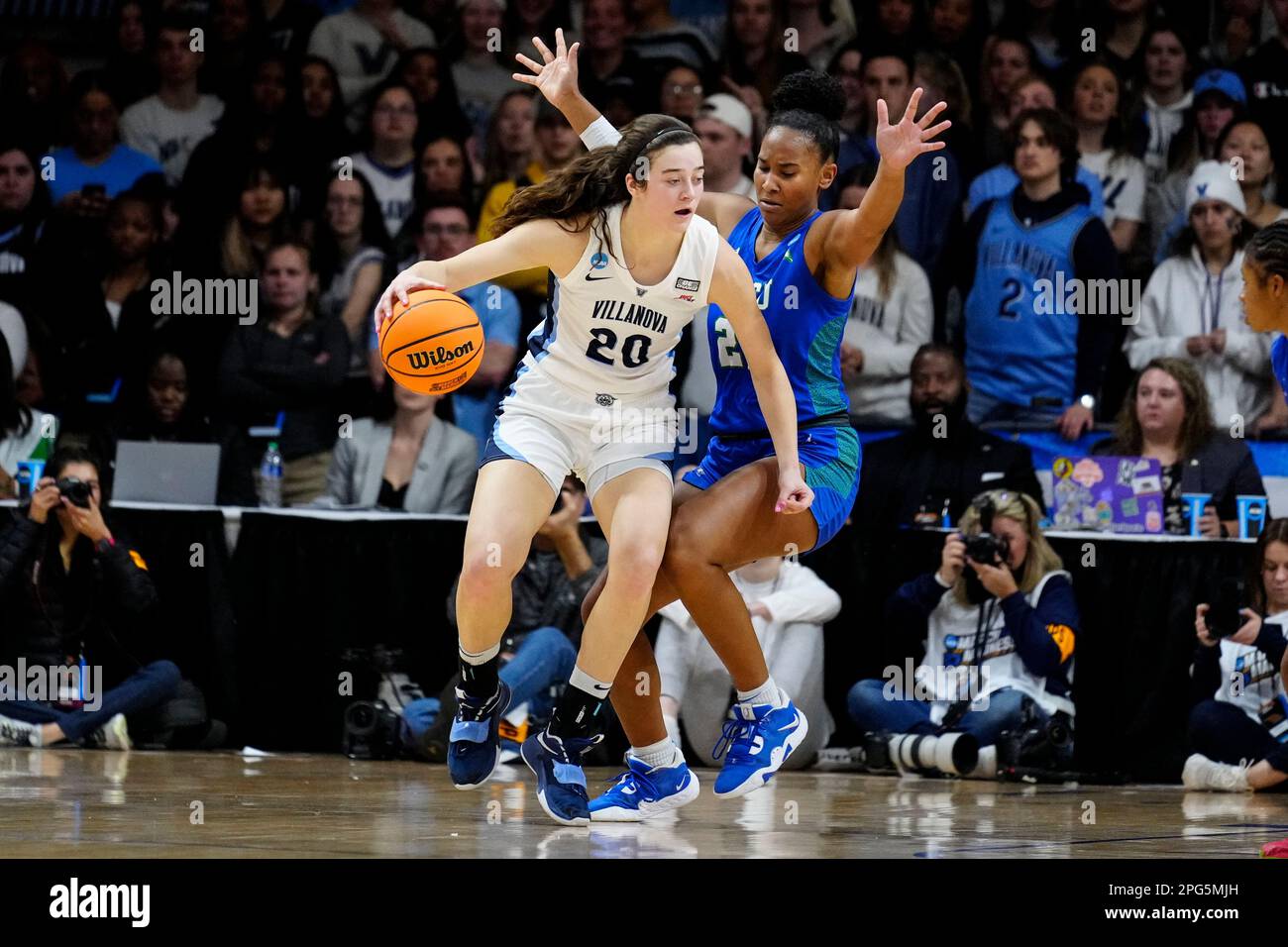 Villanova's Maddy Siegrist, left, drives to the net against Florida ...