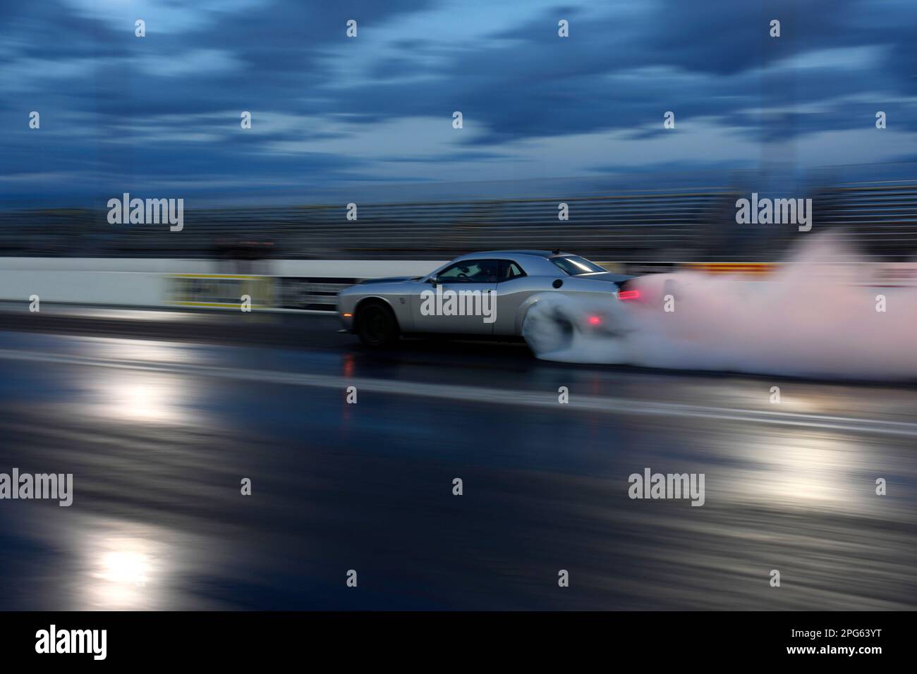The 2023 Challenger SRT Demon 170 races down a drag strip during an ...