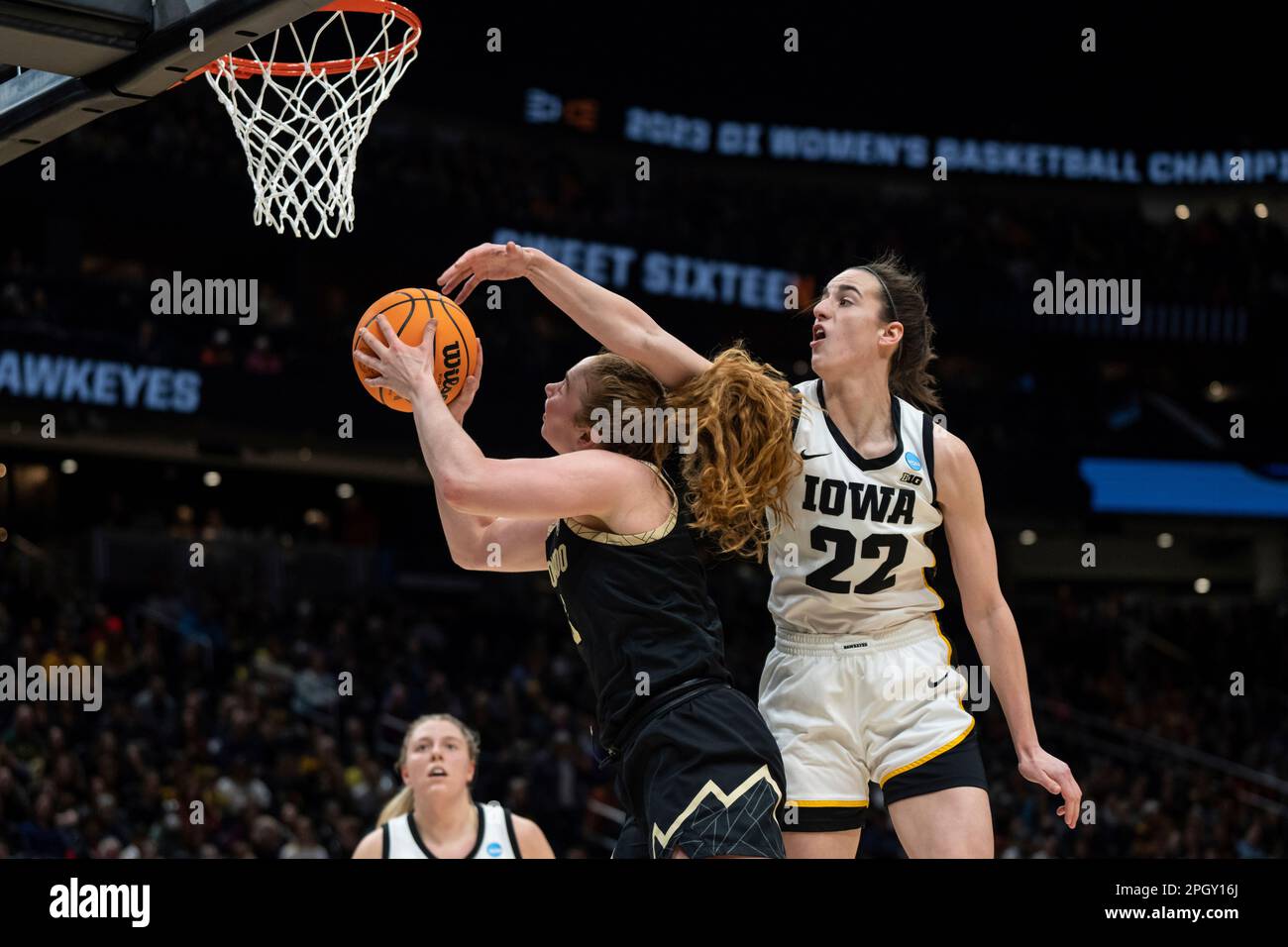 Colorado guard Frida Formann, left, goes up for a shot against Iowa ...