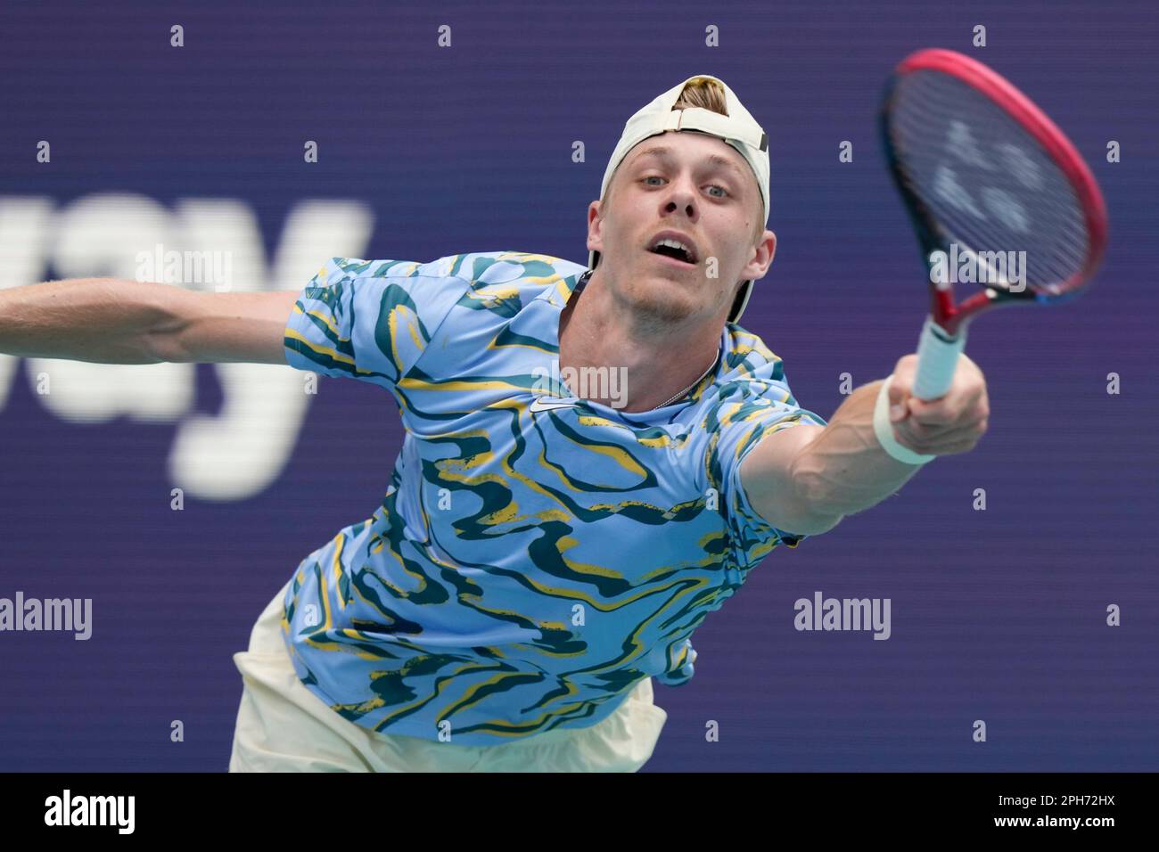 Denis Shapovalov of Canada reaches for a serve by Taylor Fritz during the Miami Open tennis ...