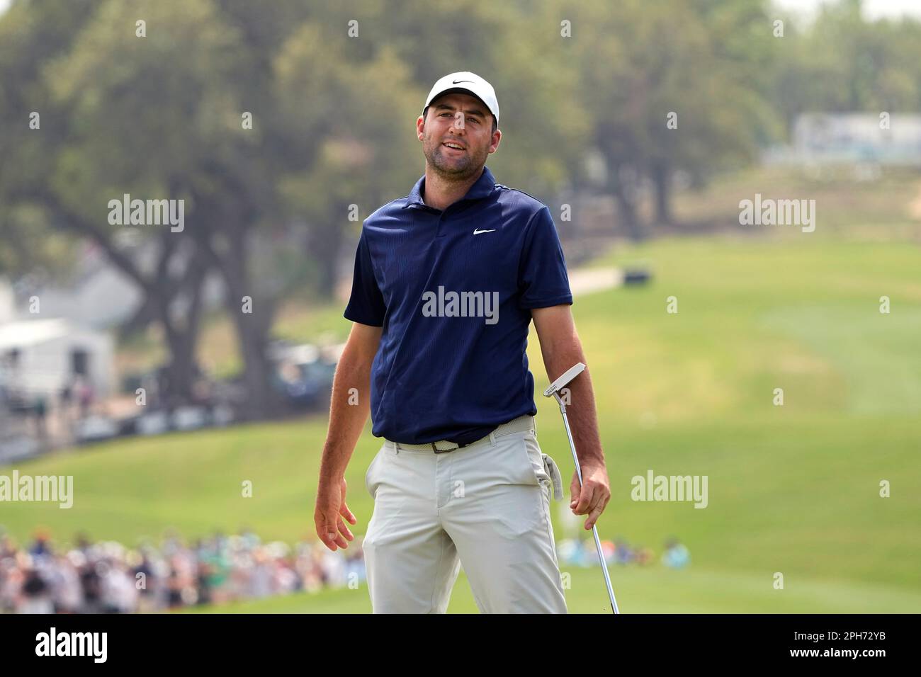 Scottie Scheffler reacts to missing a putt on a playoff hole against ...