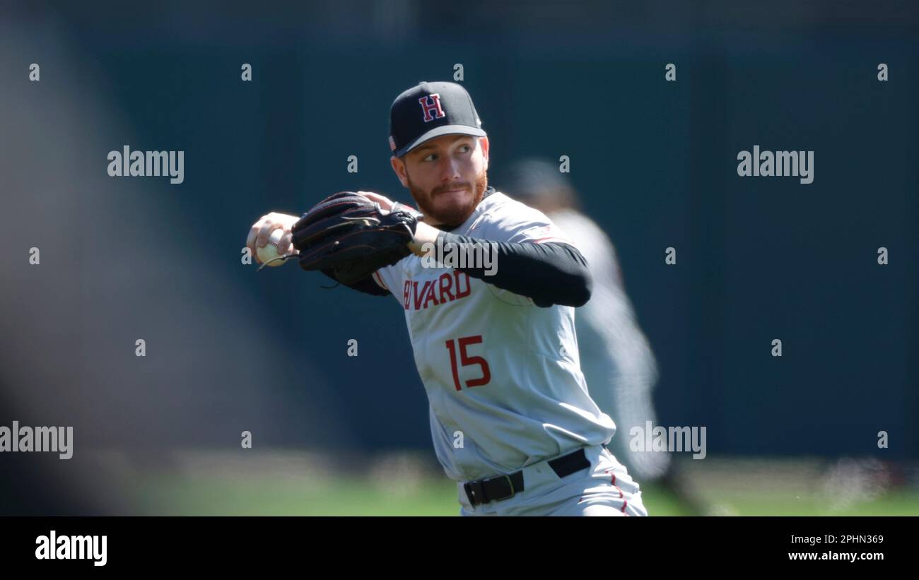 Harvard infielder Jake Berger makes a a play against Penn during an ...