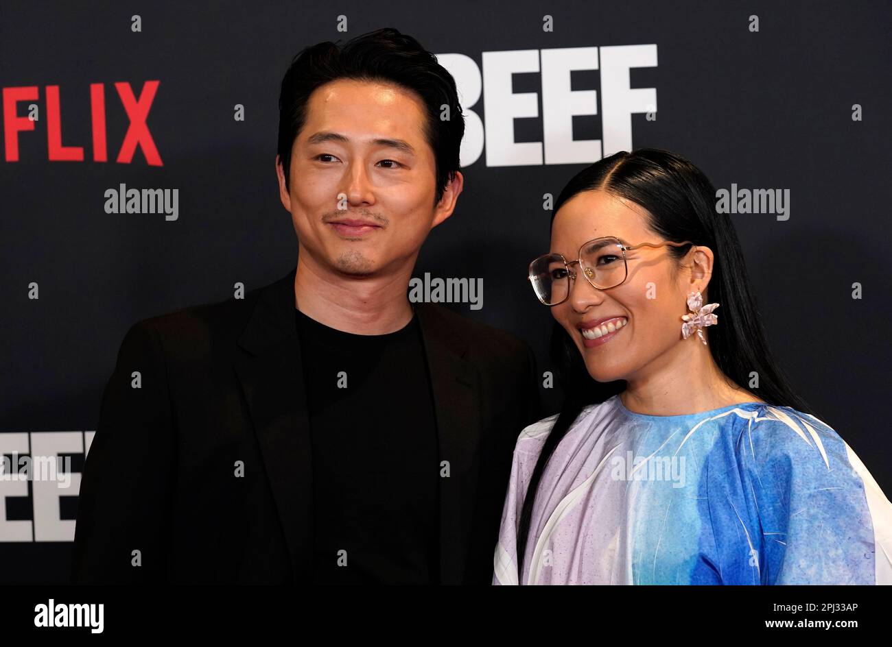 Steven Yeun, left, and Ali Wong, cast members in "Beef," pose together at the premiere of the ...