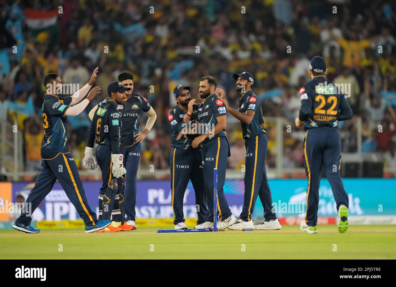 Teammates congratulate Gujarat Titan's Mohammed Shami for the dismissal ...