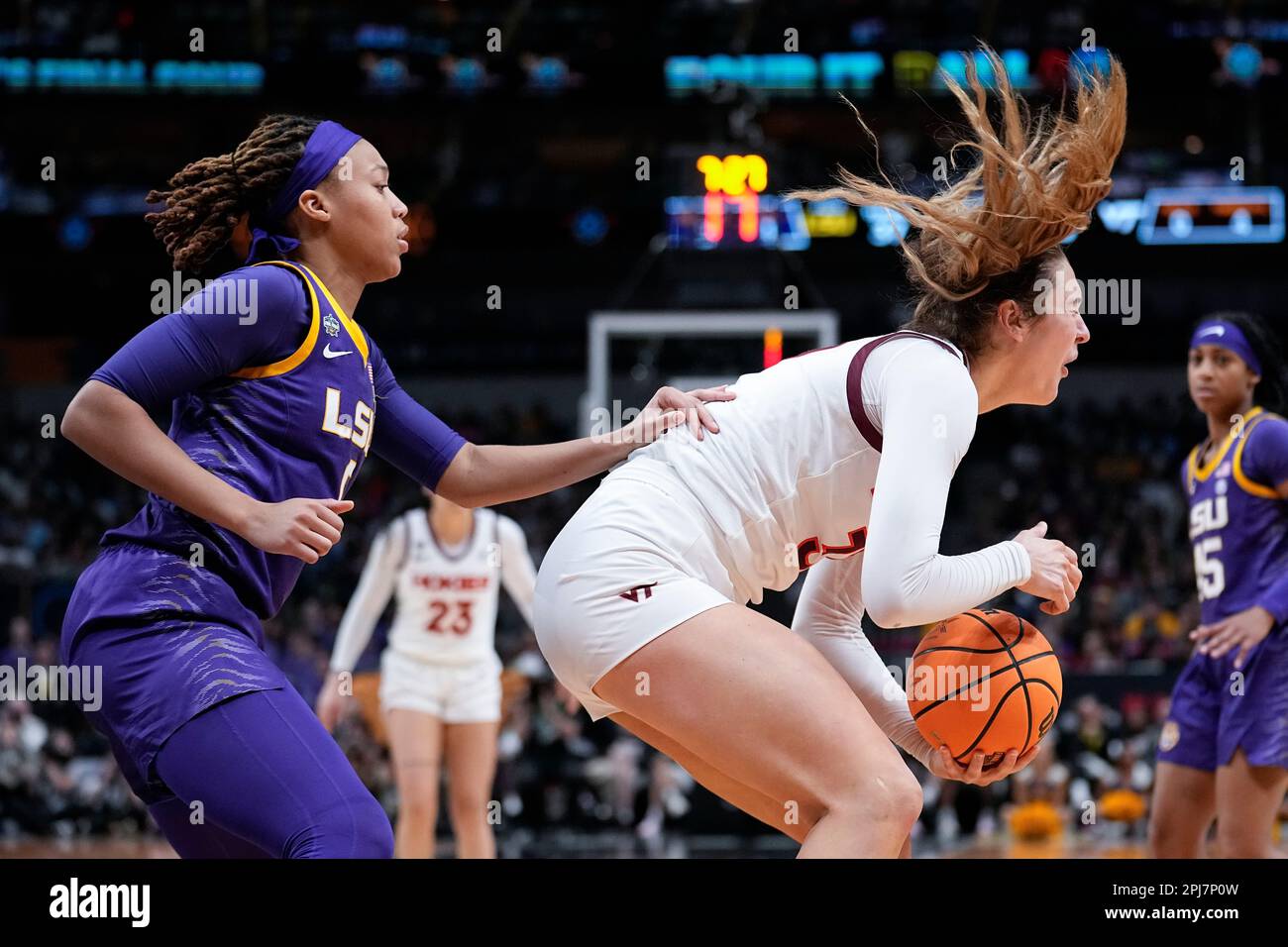 Virginia Tech's Elizabeth Kitley is fouled by LSU's LaDazhia Williams ...