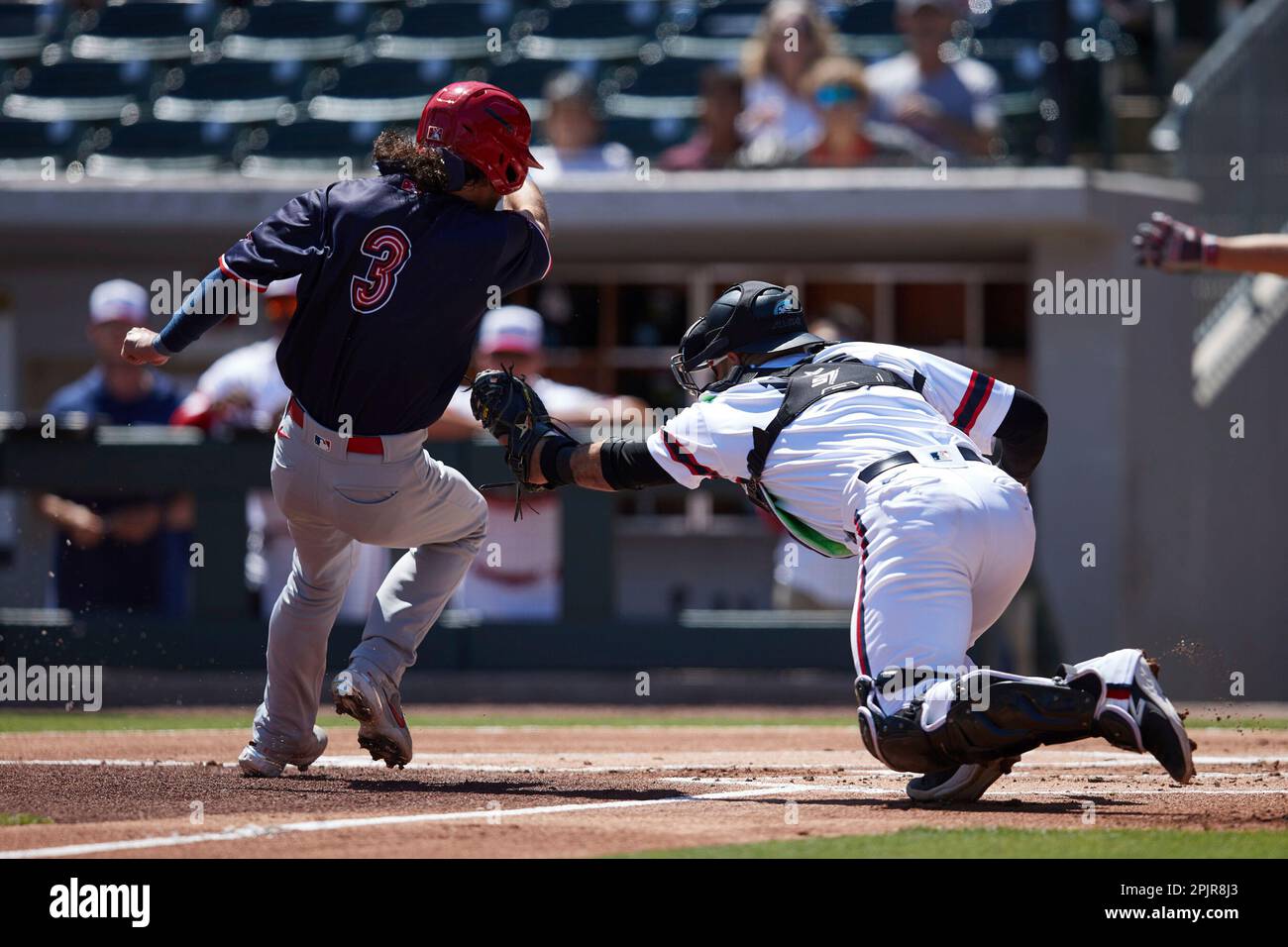 Kramer Robertson (3) of the Memphis Redbirds avoids the tag attempt by ...