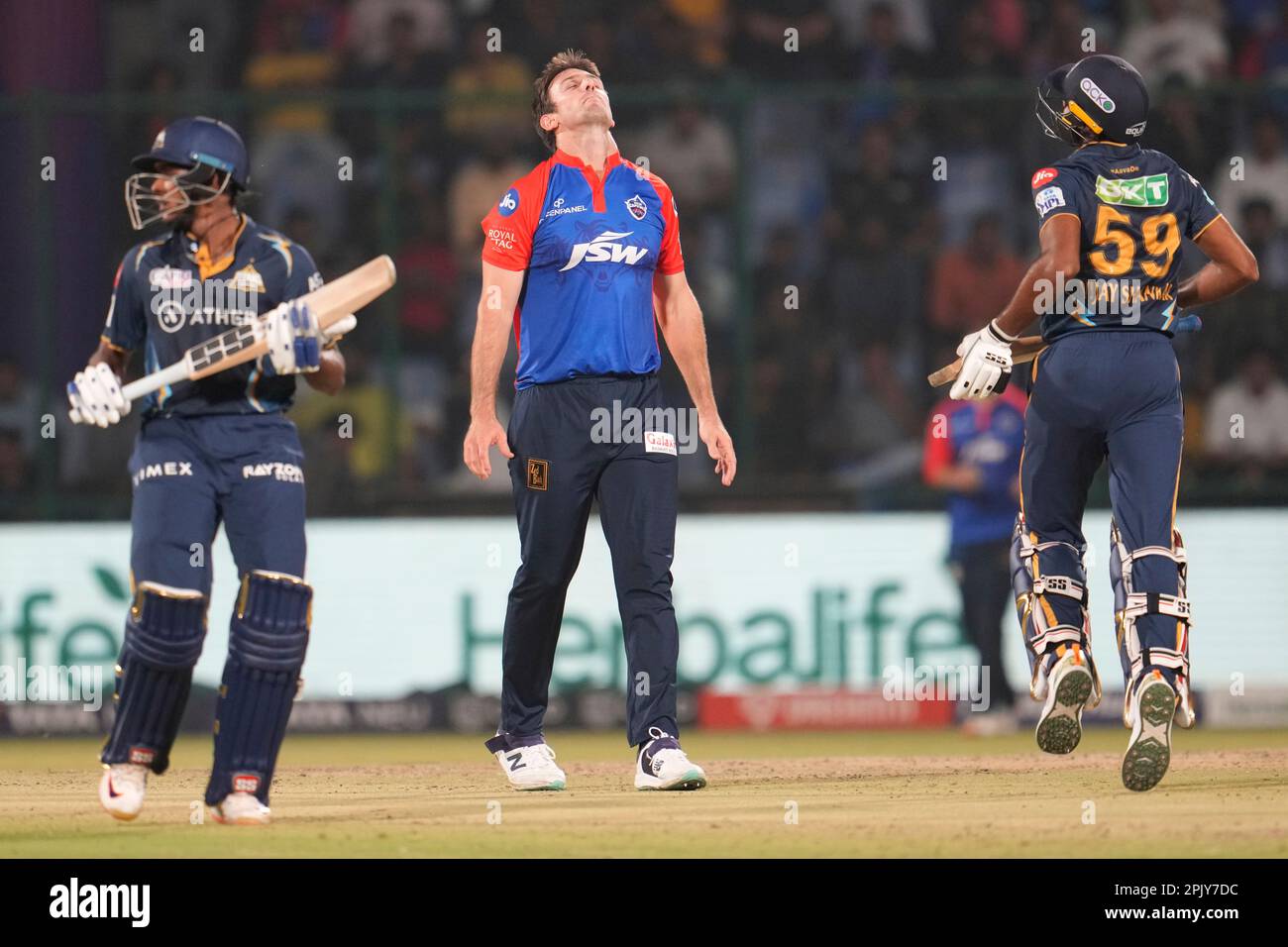 Delhi Capitals Mitchell Marsh, center, reacts as Gujarat Titan players ...