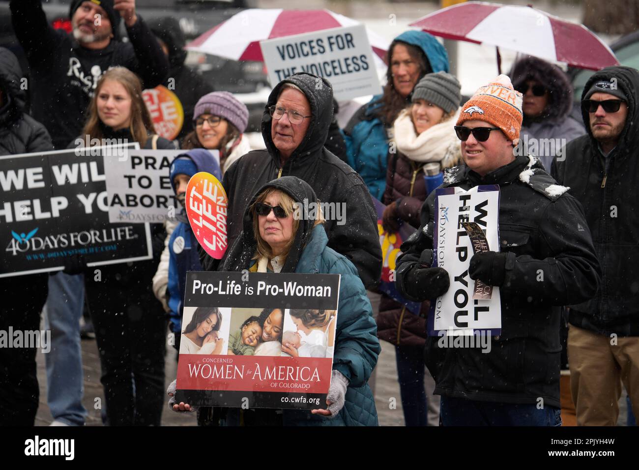 Attendees wave placards during a rally to protest the one-year ...