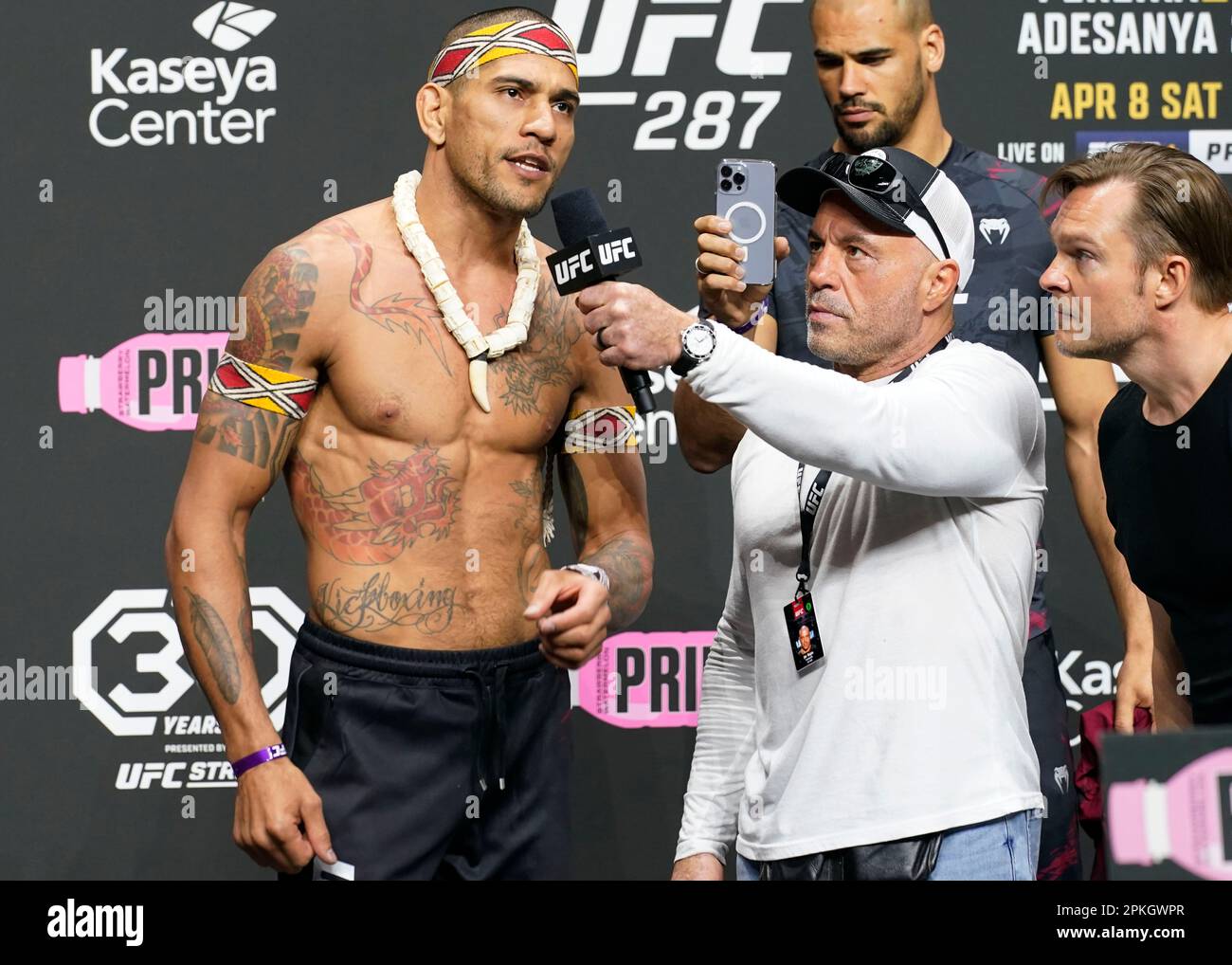 UFC commentator Joe Rogan, second from left, listens to Alex Pereira ...