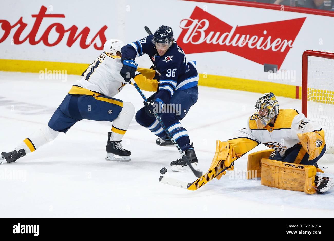 Winnipeg Jets' Morgan Barron's (36) shot is saved by Nashville ...