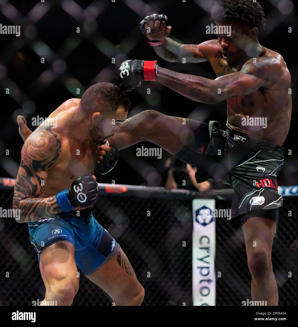 Kevin Holland, right, and Santiago Ponzinibbio fight in their ...