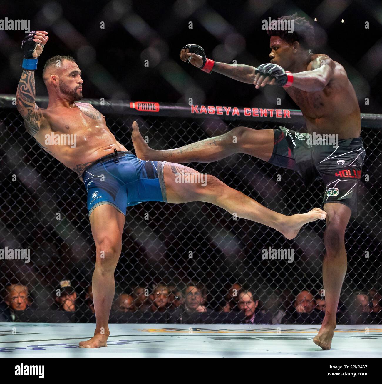Kevin Holland, right, and Santiago Ponzinibbio fight in their ...