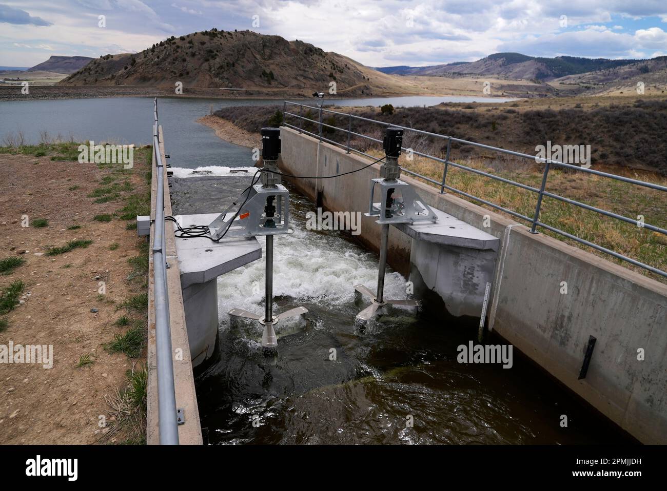 Water flows through an irrigation canal with a turbine at Ralston ...