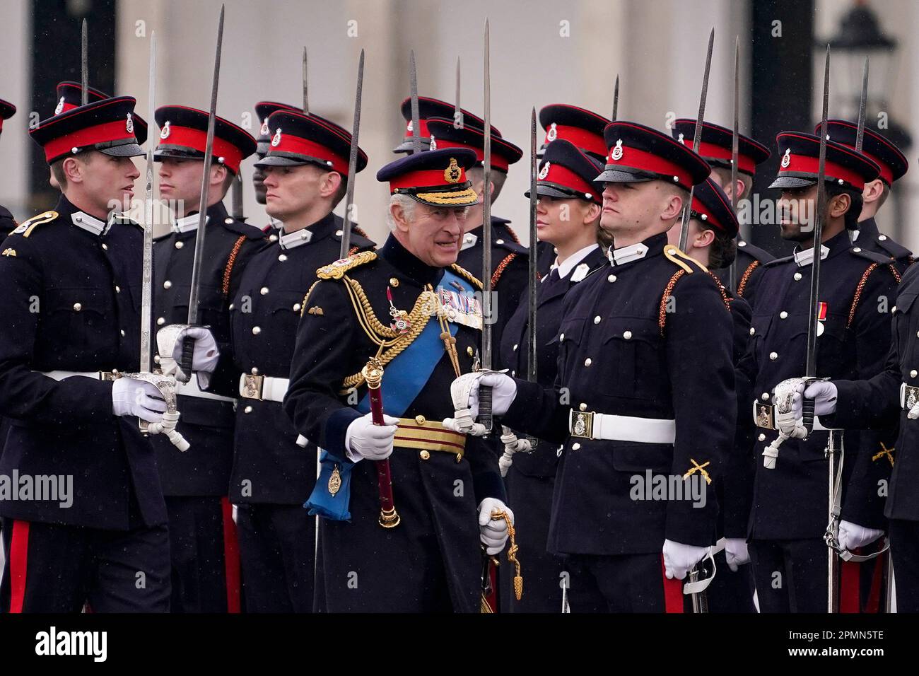 Britain's King Charles III, centre, arrives to inspect the 200th Royal ...