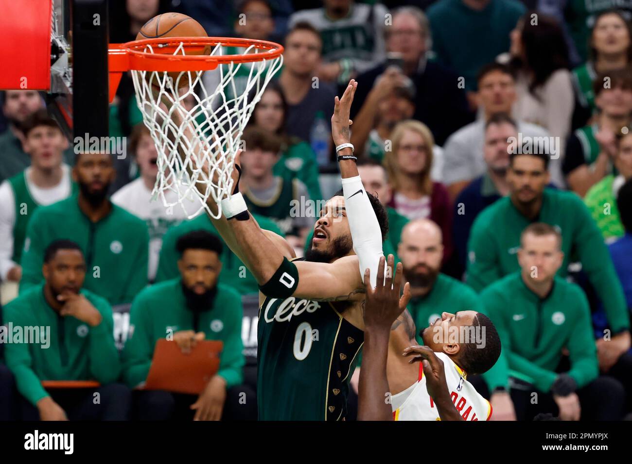 Boston Celtics' Jayson Tatum (0) shoots against Atlanta Hawks' Dejounte ...
