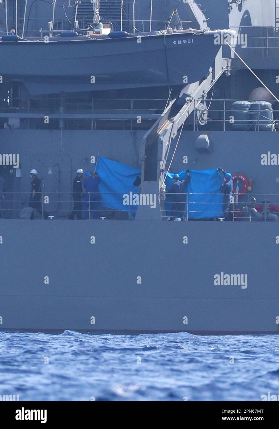Crew members of the Chihaya, a submarine rescue ship of the Japan ...