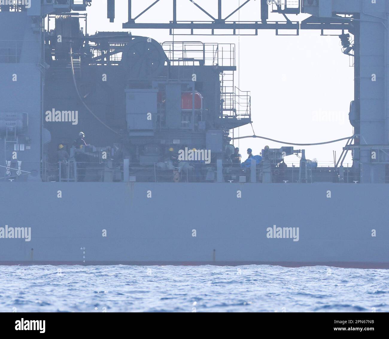 Crew members of the Chihaya, a submarine rescue ship of the Japan ...