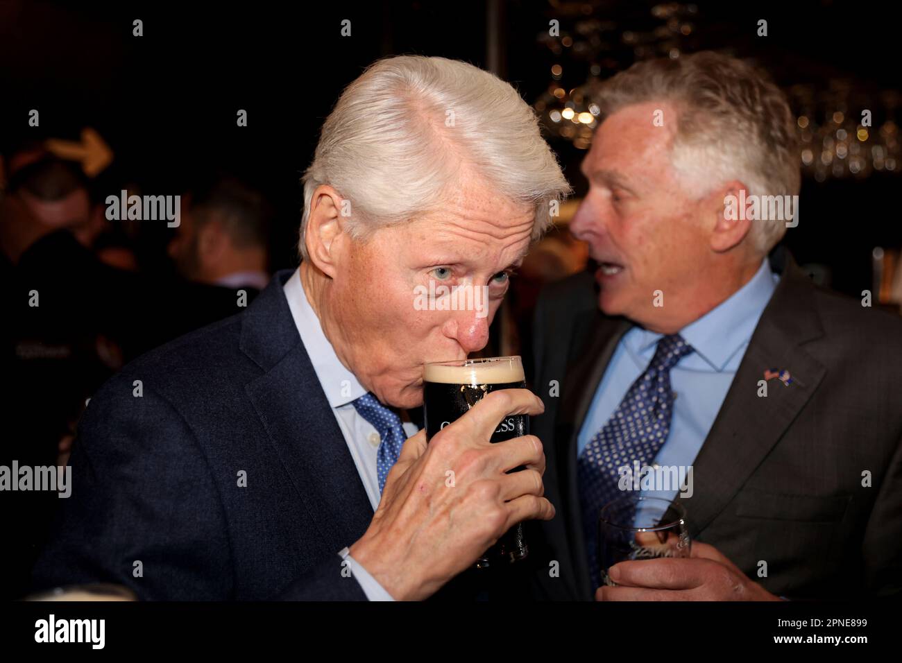 Former US president Bill Clinton enjoys a pint of Guinness in the Tap ...