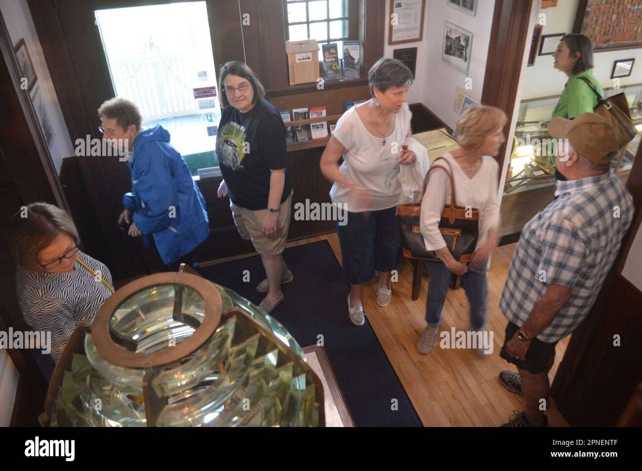 Visitors peruse some of the historical items on display at the Old ...