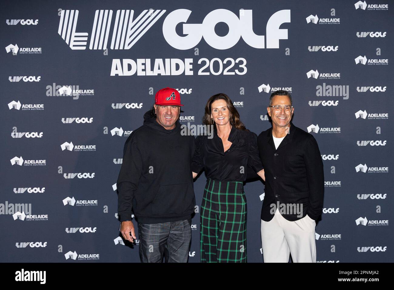 Pat Perez of 4Aces GC, an attendee and Claude Harmon pose for a photo ...