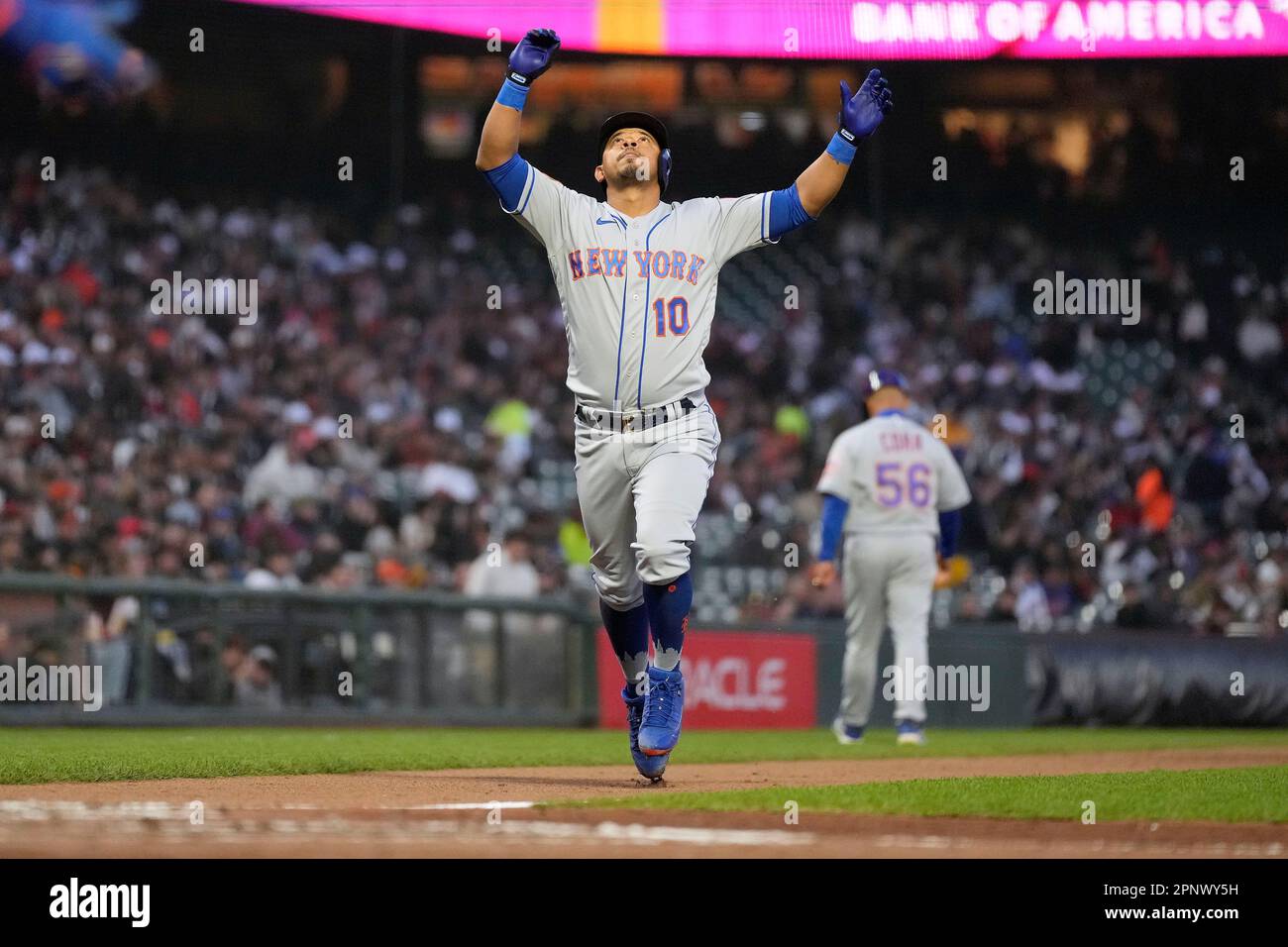 New York Mets' Eduardo Escobar gestures as he crosses home plate after ...