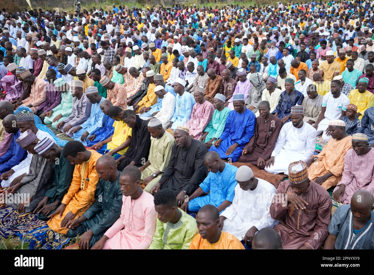Nigerian Muslims pray in an open ground field during the Eid al-Fitr ...