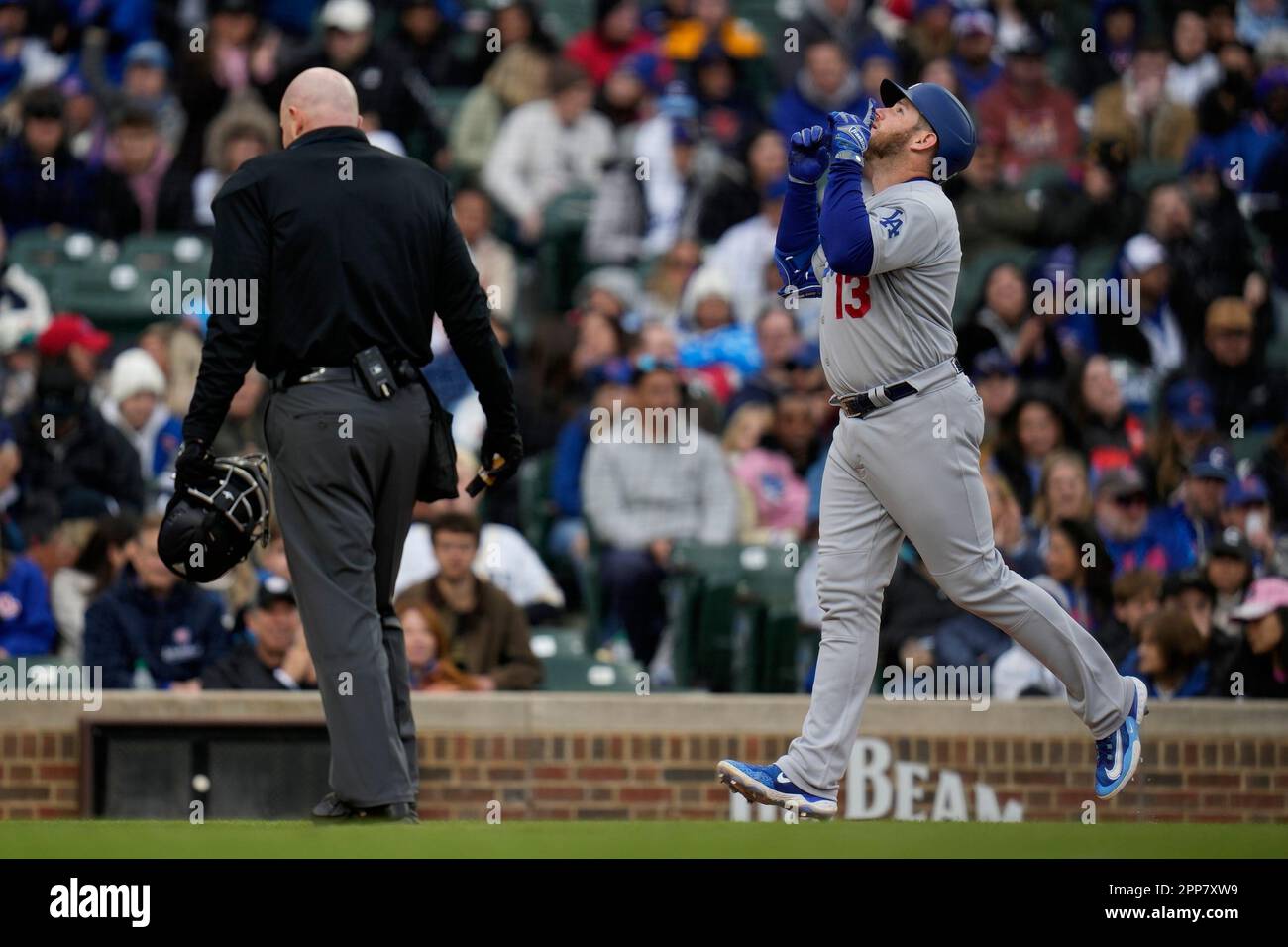 Los Angeles Dodgers' Max Muncy points to the sky as he crosses home ...