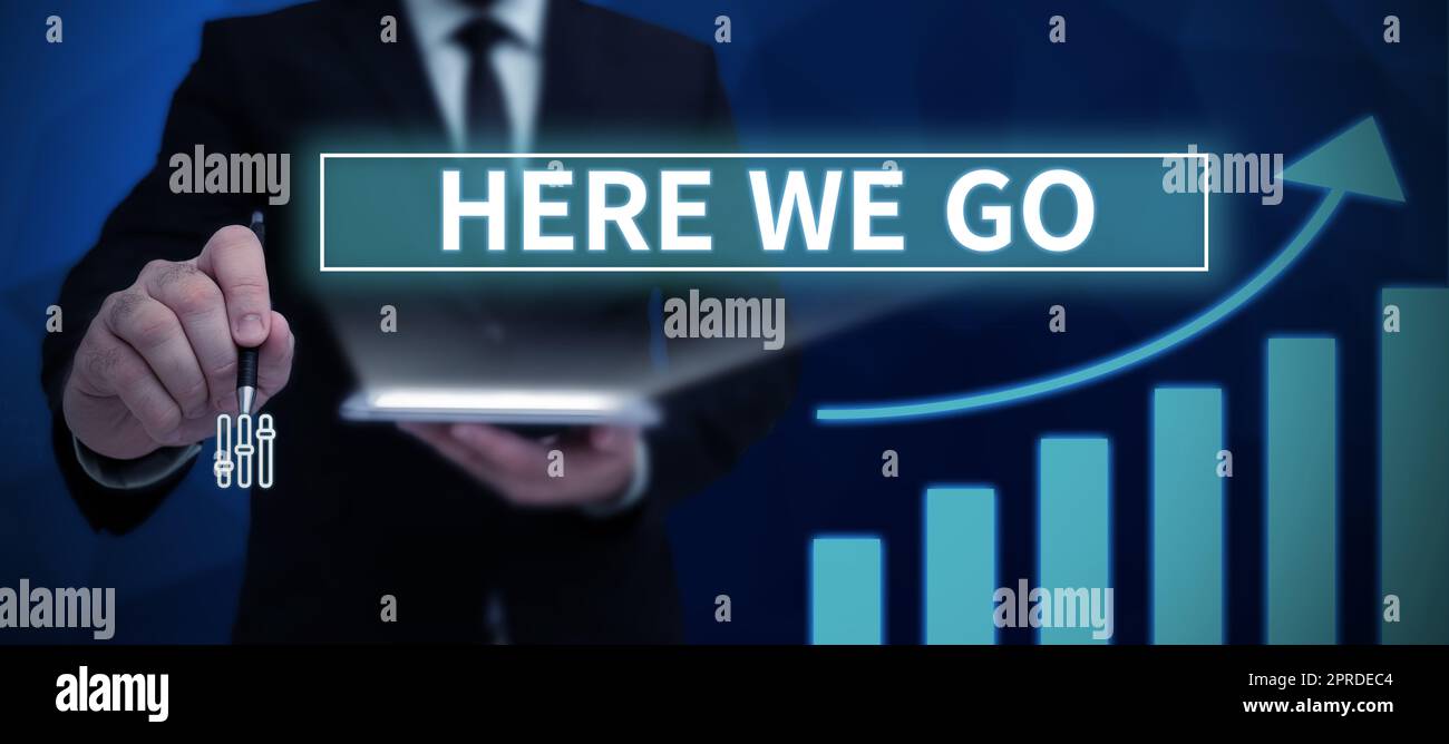 Das Schild zeigt „Here We Go“. Geschäftsidee auf dem Weg zu einem Plan Business Rahmen dekoriert ...