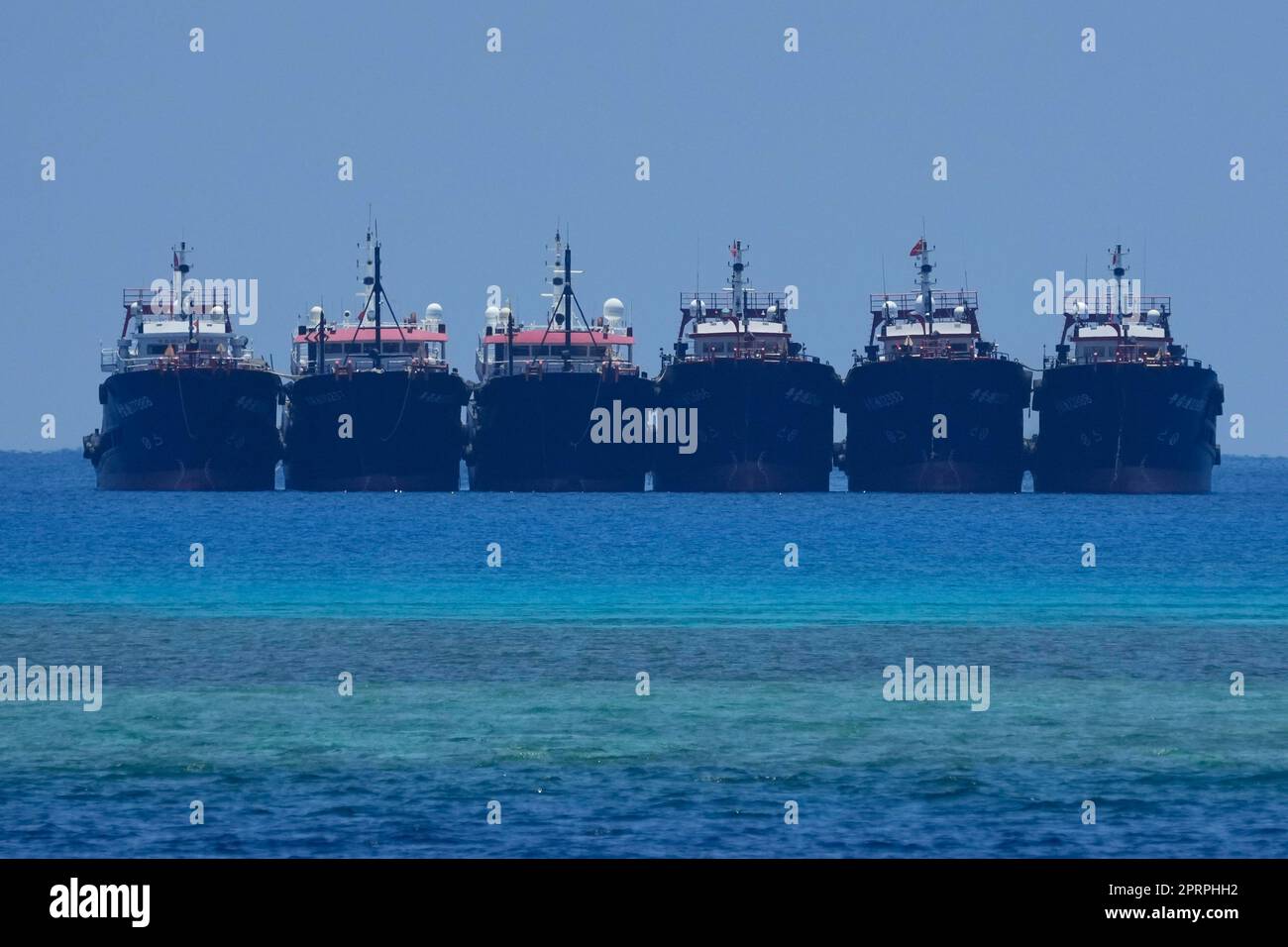 Some of the many suspected Chinese militia ships lay side by side at ...