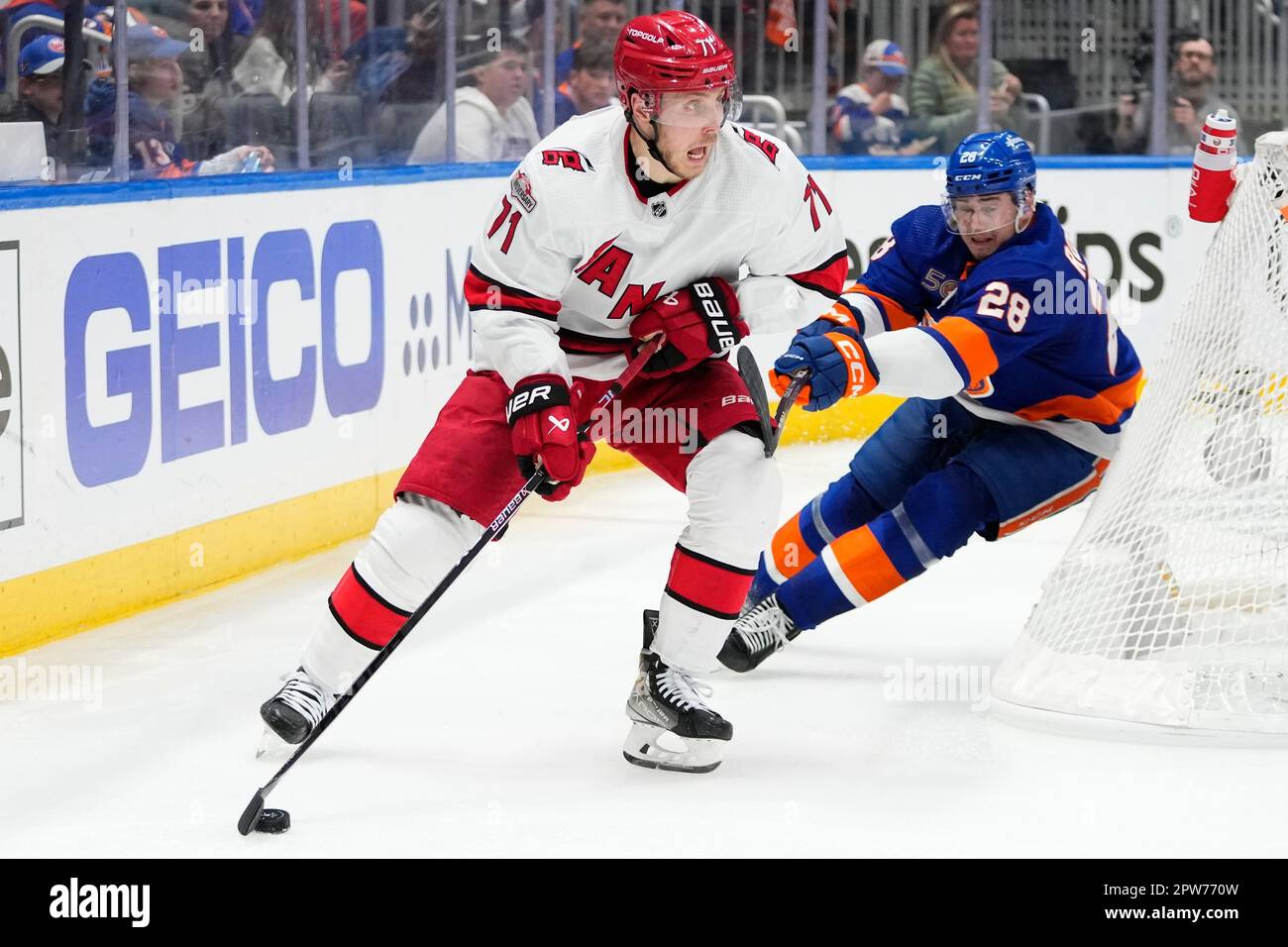 Carolina Hurricanes' Jesper Fast (71) looks to pass the puck away from ...