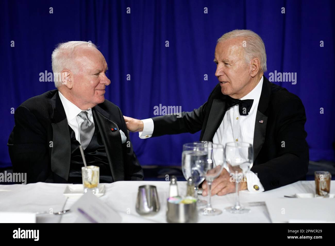 President Joe Biden talks with John F. Lansing, President and CEO of ...