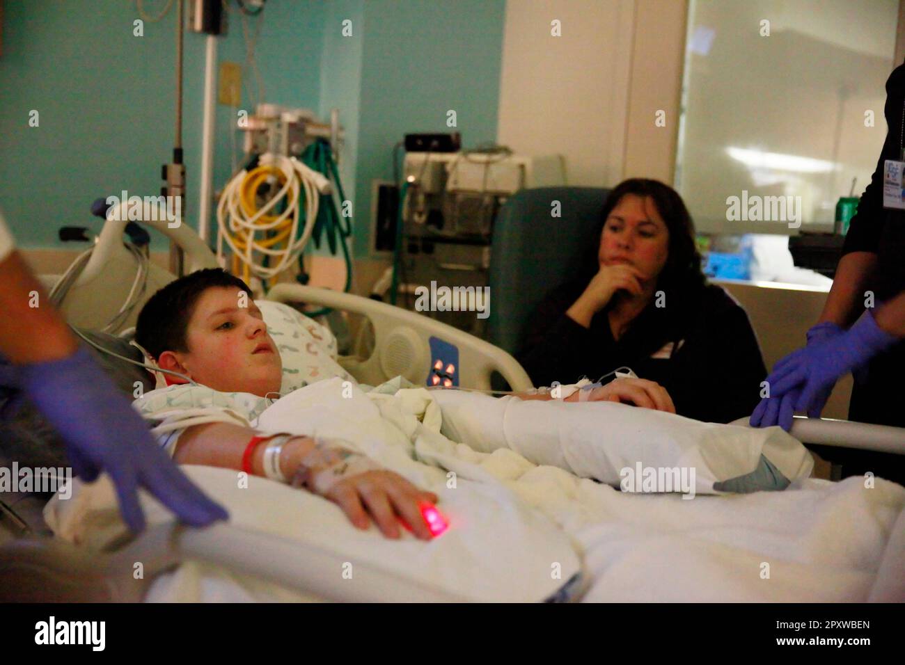 Pediatric stroke neurologist Christine Fox (hand at right) and ...