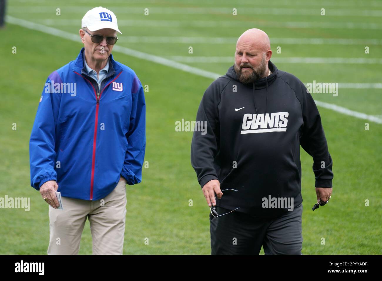 New York Giants head coach Brian Daboll, right, walks off the field ...