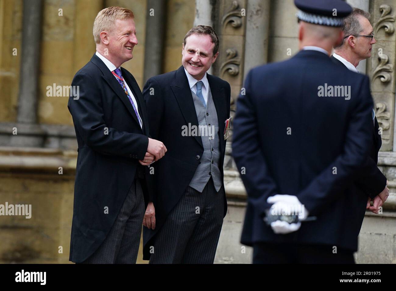 Deputy Prime Minister Oliver Dowden, left, arrives ahead of the ...