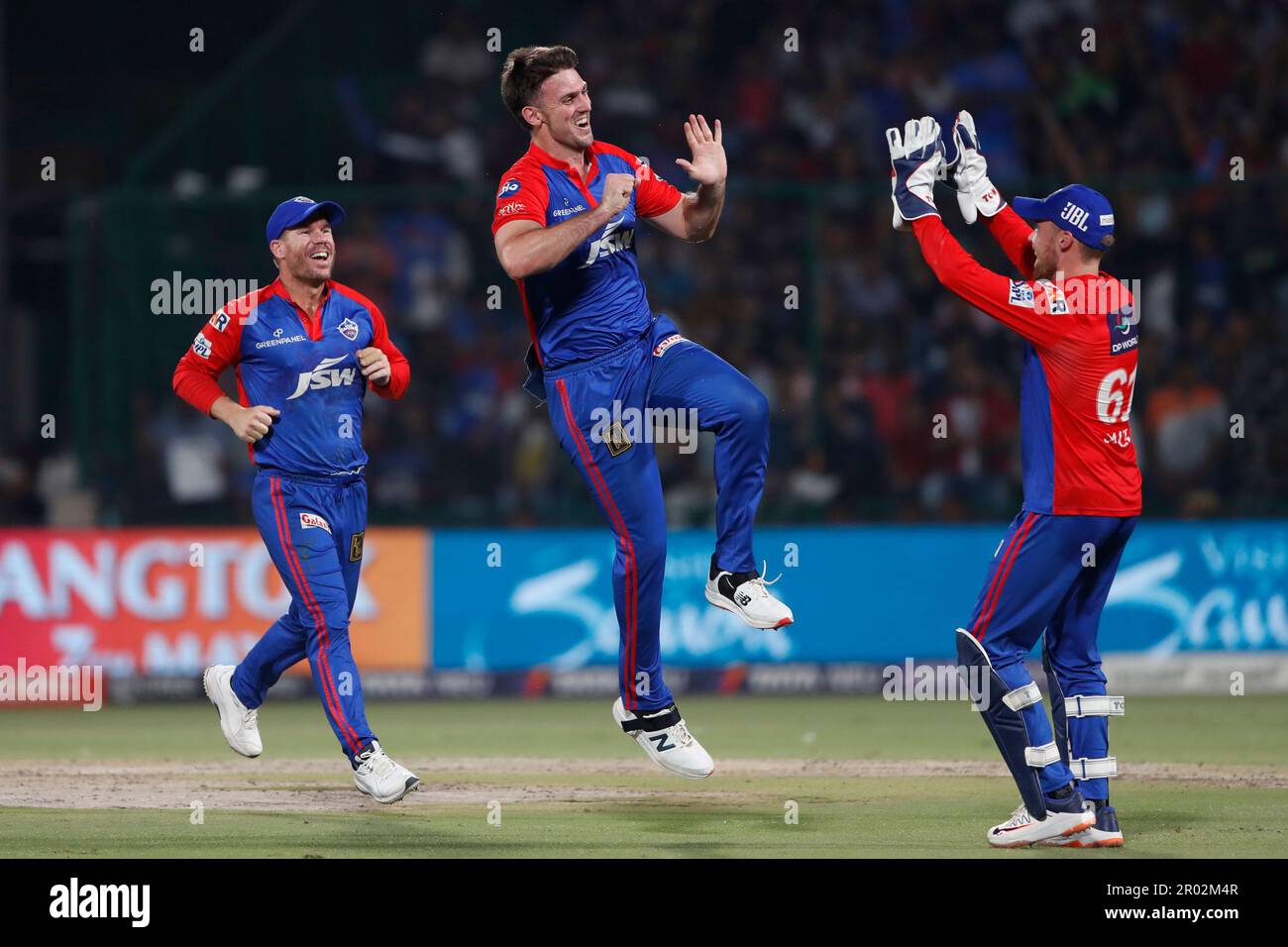 Delhi Capitals' captain David Warner runs towards teammate Mitchell ...