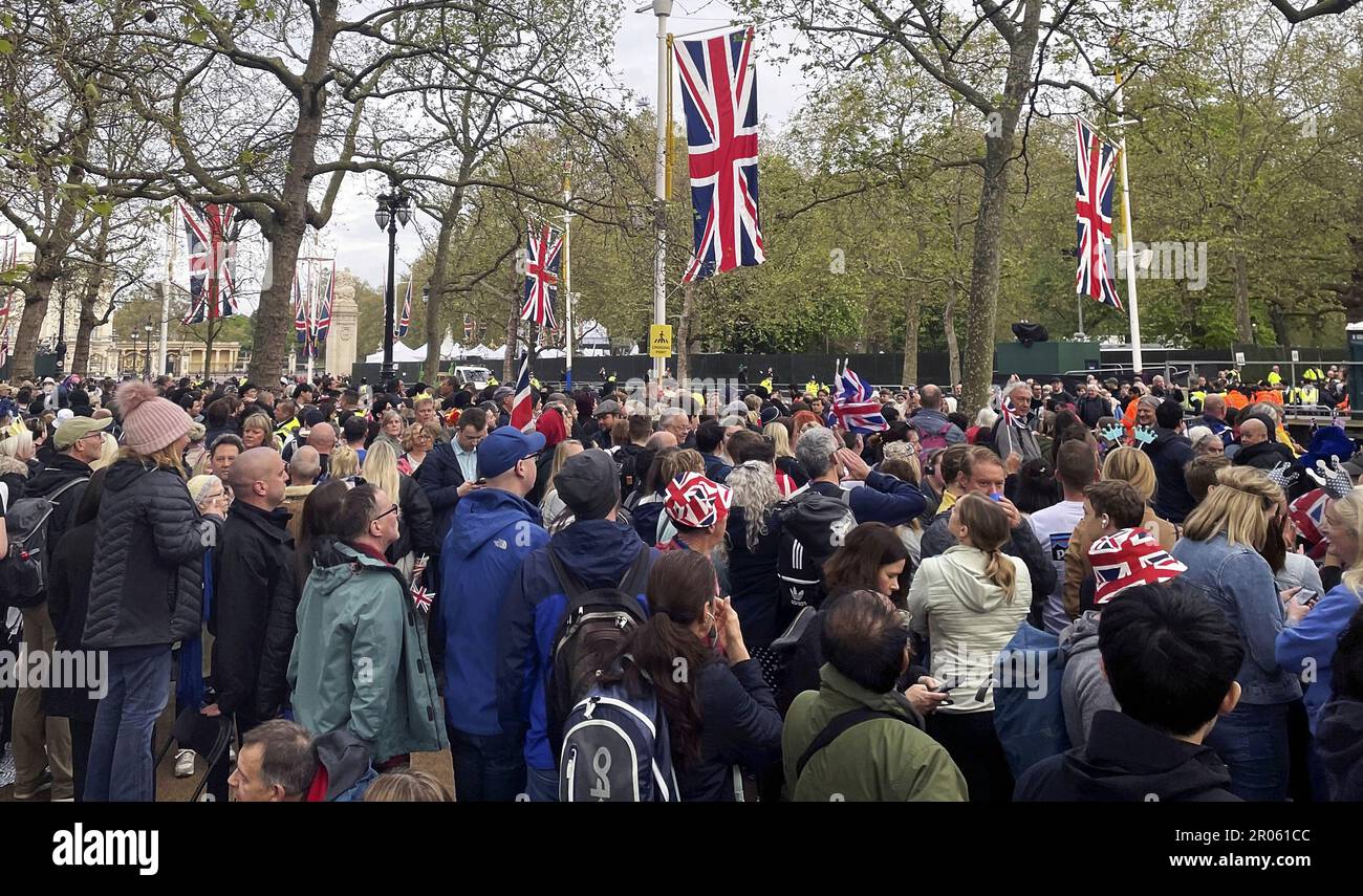 People gather near Buckingham Palace along the parade route for ...