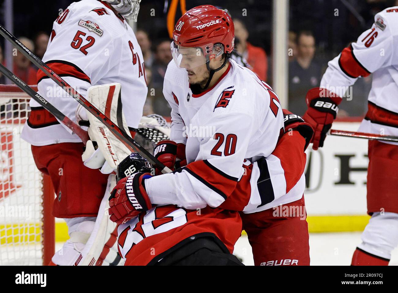 Carolina Hurricanes center Sebastian Aho (20) fights with New Jersey ...
