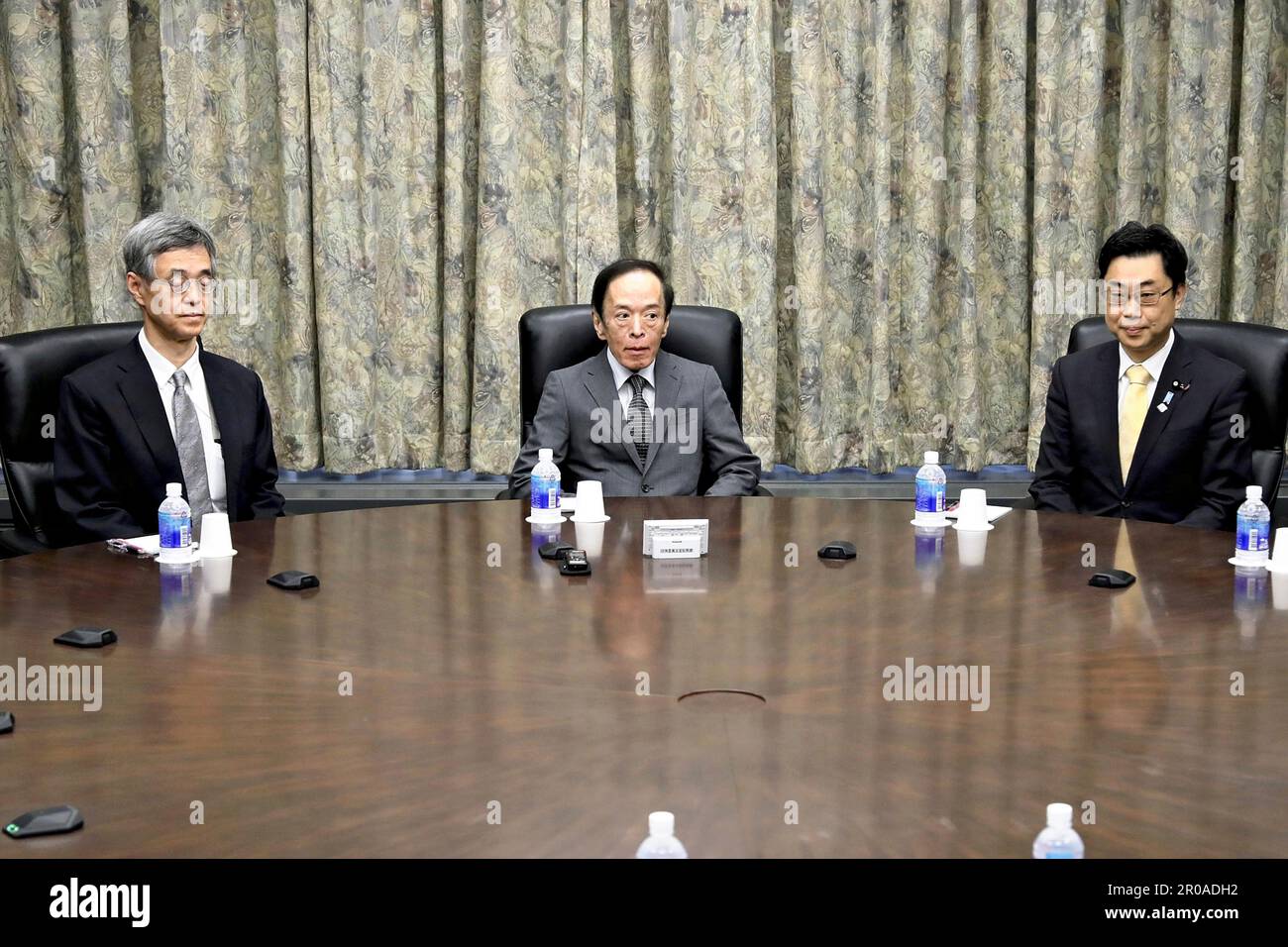 Bank of Japan Governor Kazuo Ueda(C) attends the BOJ's two-day policy ...