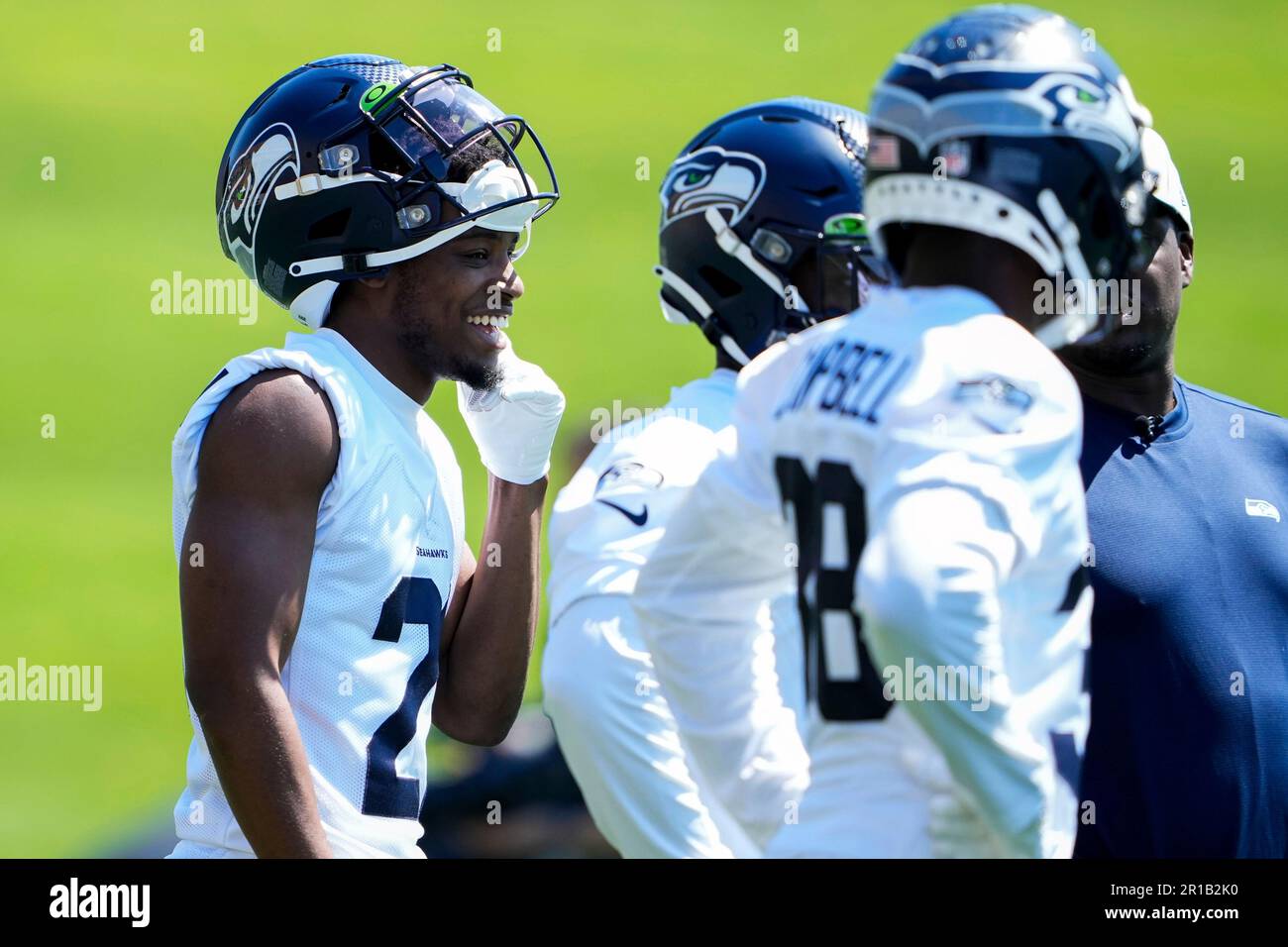 Seattle Seahawks cornerback Devon Witherspoon (21) smiles with ...
