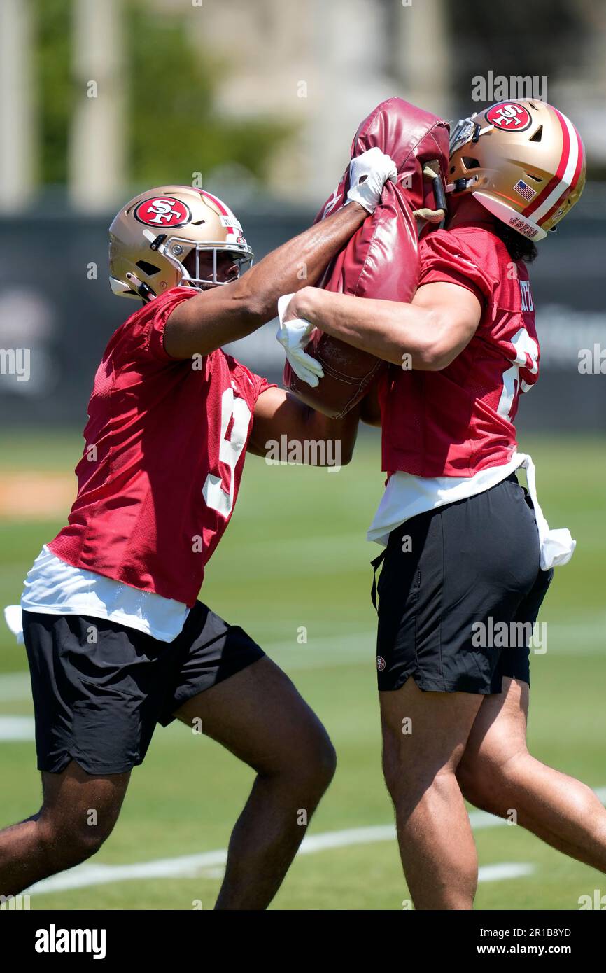 San Francisco 49ers' Brayden Willis, left, and Cameron Latu take part ...