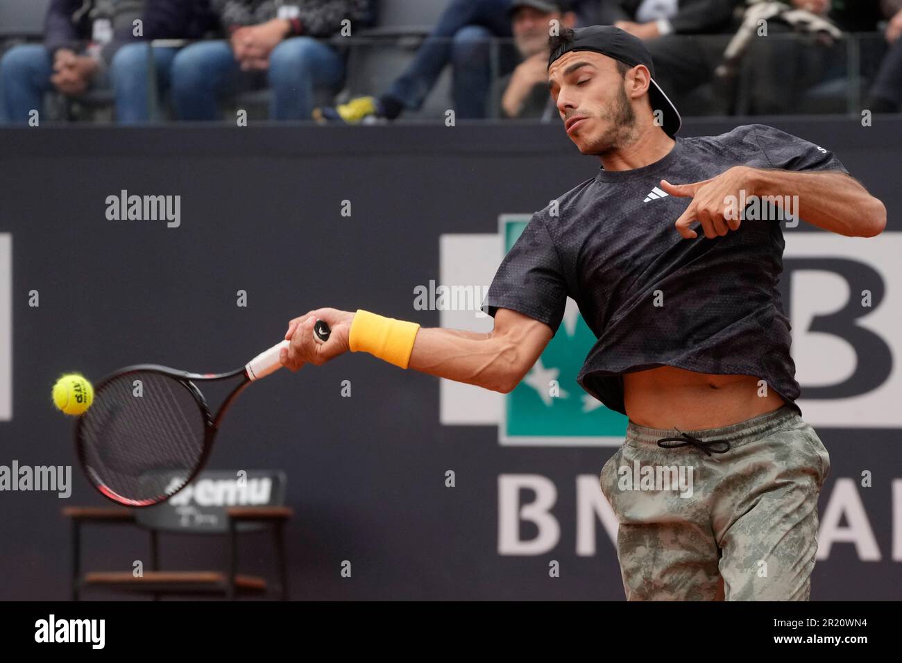 Argentina's Francisco Cerundolo returns the ball to Italy's Jannik ...