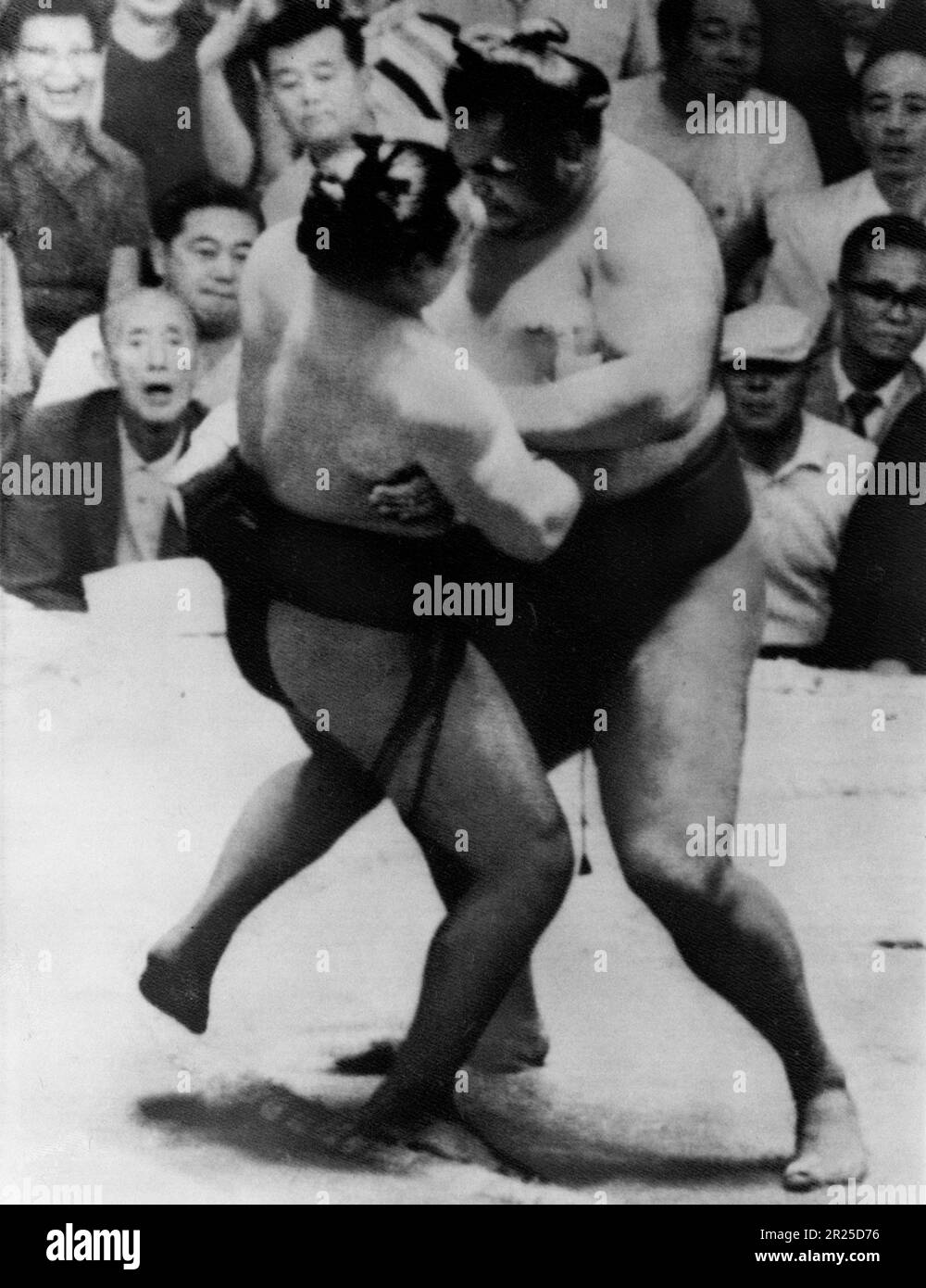 Jesse Kuhaulua, right, a Hawaiian sumo wrestler, pushes his lower ...