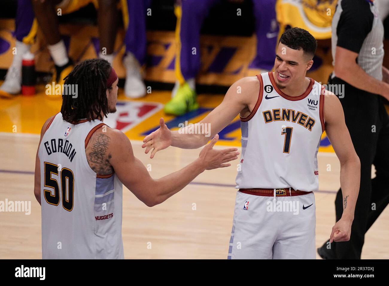 Denver Nuggets forward Michael Porter Jr. (1) shakes hands with forward ... Denver Nuggets forward Michael Porter Jr. (1) shakes hands with forward ...