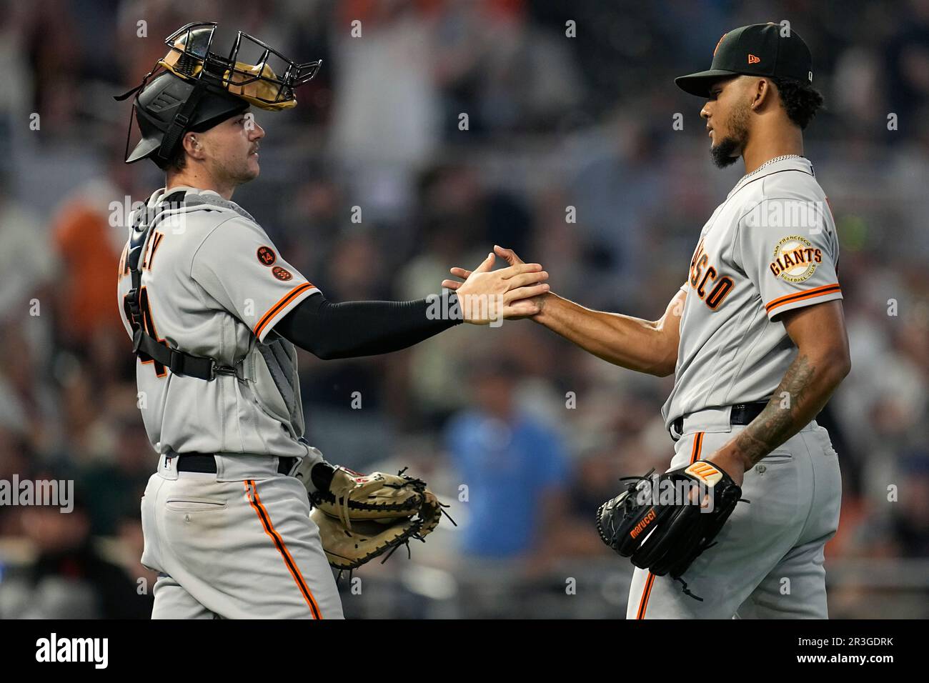 San Francisco Giants catcher Patrick Bailey, left, and relief pitcher Camilo Doval shake hands ...