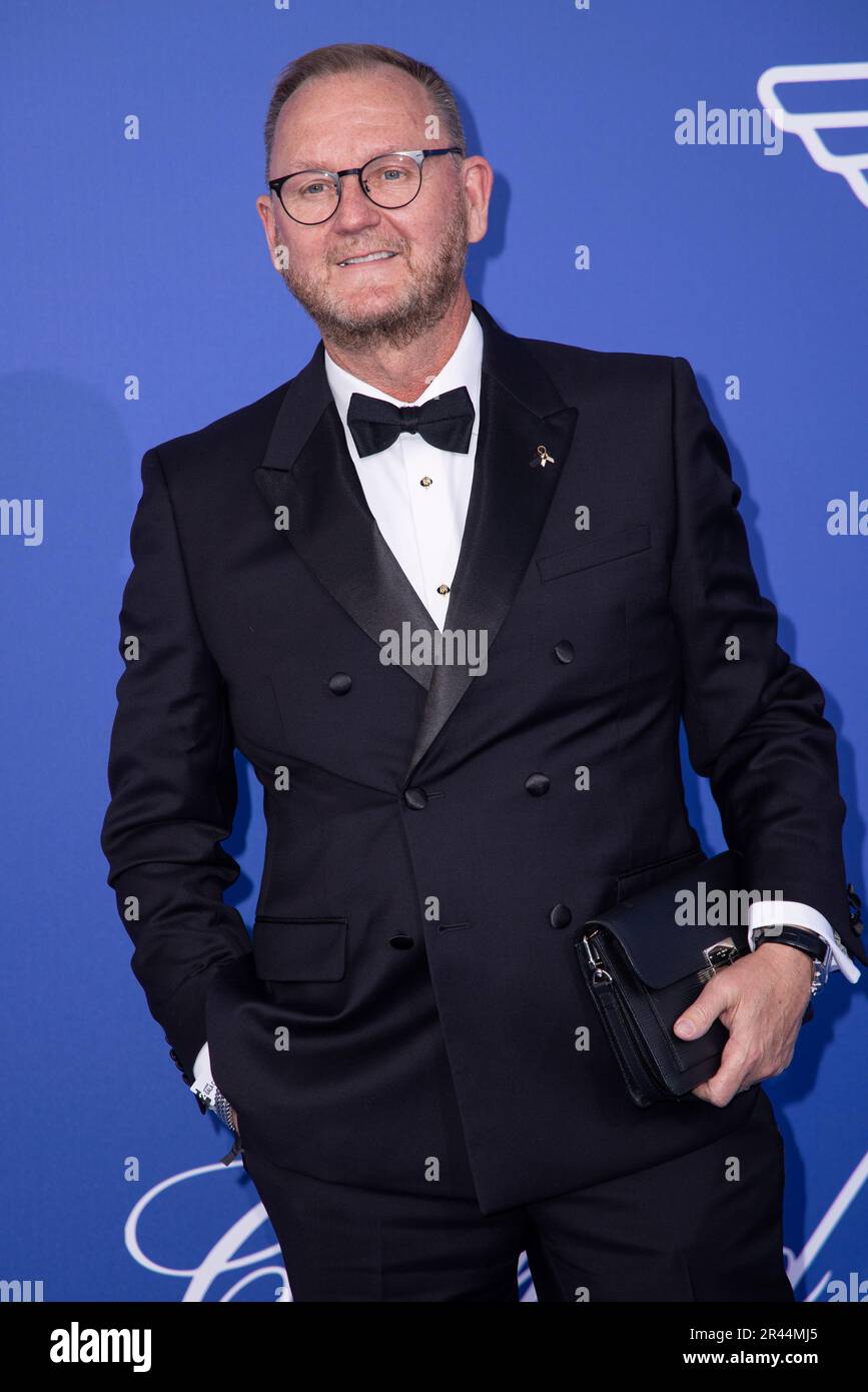 amfAR CEO Kevin Frost poses for photographers upon arrival at the amfAR ...