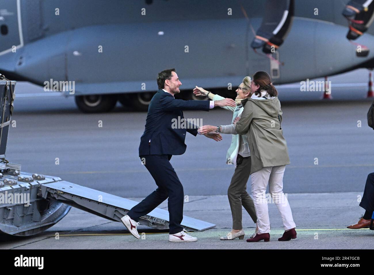 Belgium's Olivier Vandecasteele, left, is greeted by his family after ...