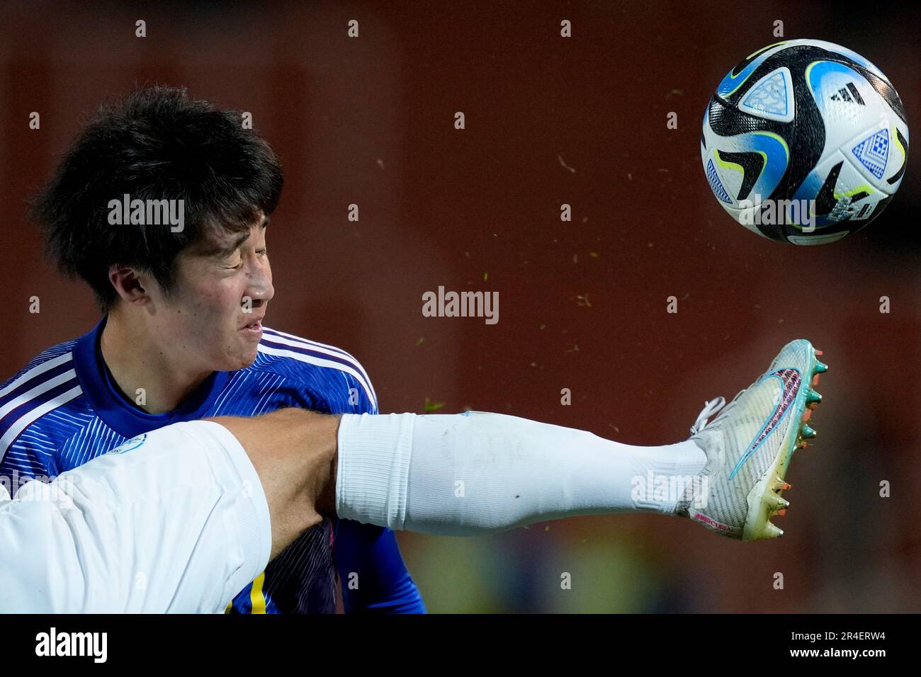 Israel's Ilay Feingold, left, strikes a ball against Japan's Taisei Abe ...