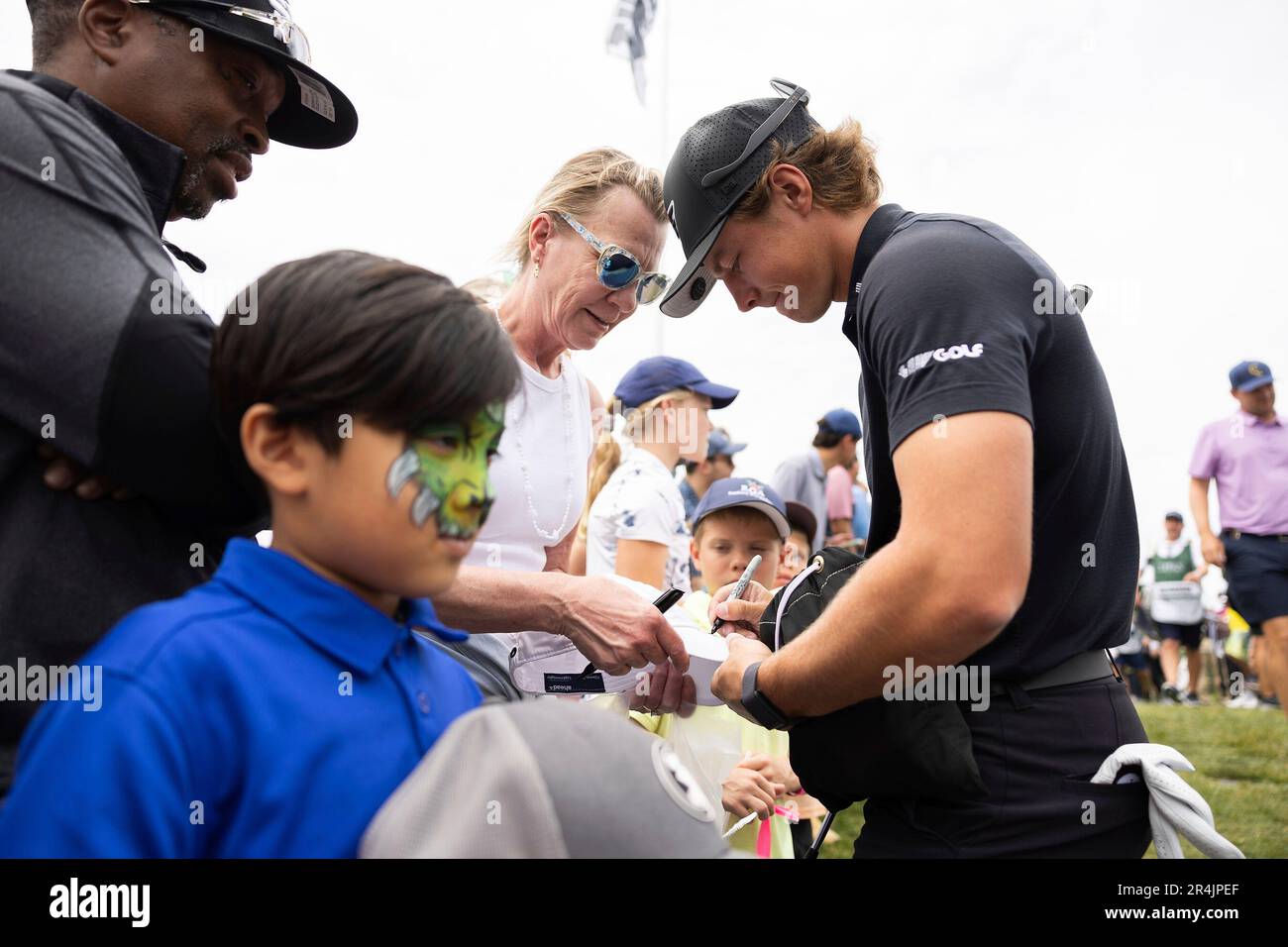 James Piot of HyFlyers GC signs autographs for fans during the final ...