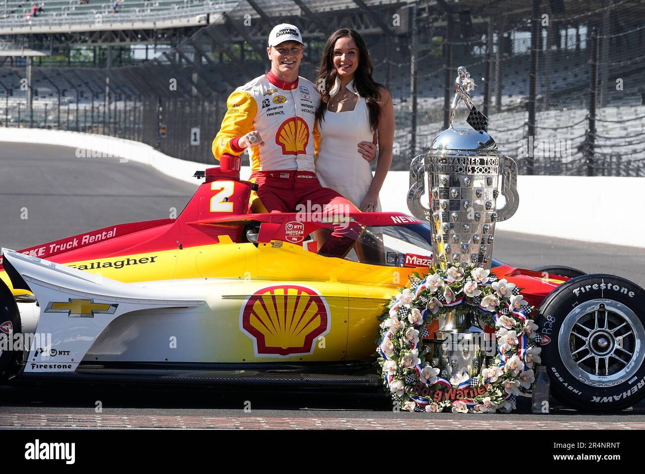Josef Newgarden poses with his wife, Ashley, and the Borg-Warner Trophy ...